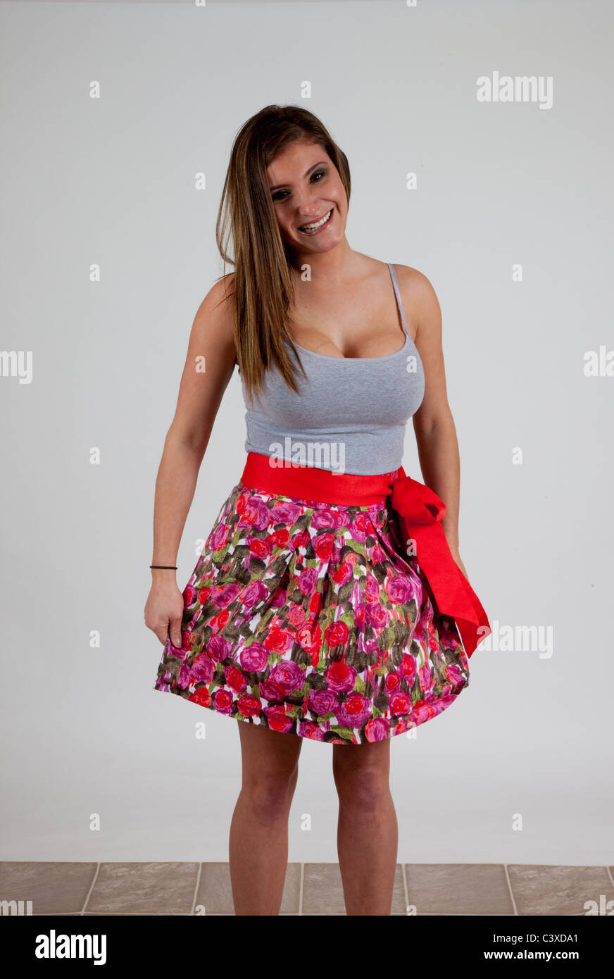 Pretty woman in front of a white background with a beautiful, friendly ...