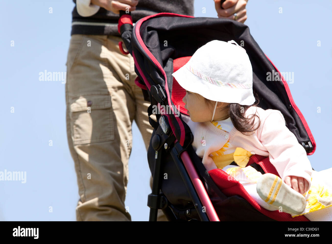 Baby Girl in Buggy Stock Photo - Alamy