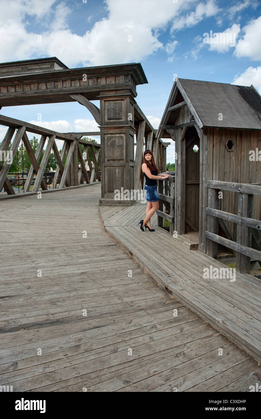 Beauty girl on old-time bridge Stock Photo - Alamy