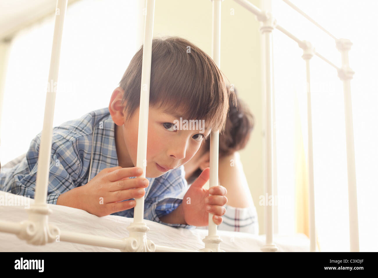 Boy making bed hi-res stock photography and images - Alamy