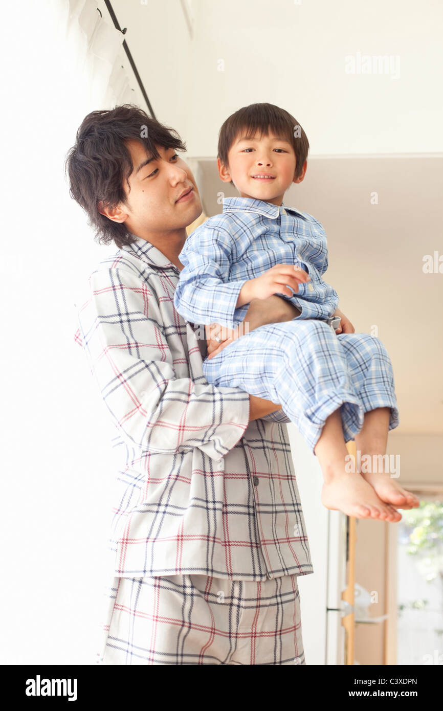 Father Lifting Son Up Stock Photo - Alamy