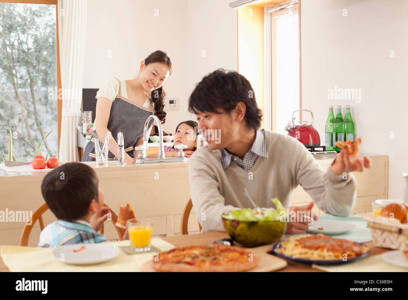 Family of Four Having Lunch Stock Photo - Alamy