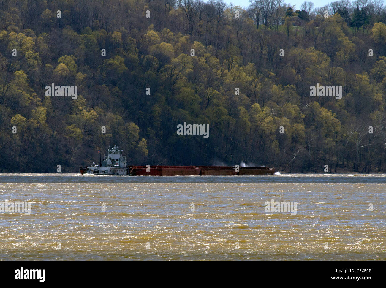 Tugboat pushing a load of barges down the Ohio River between Kentucky ...