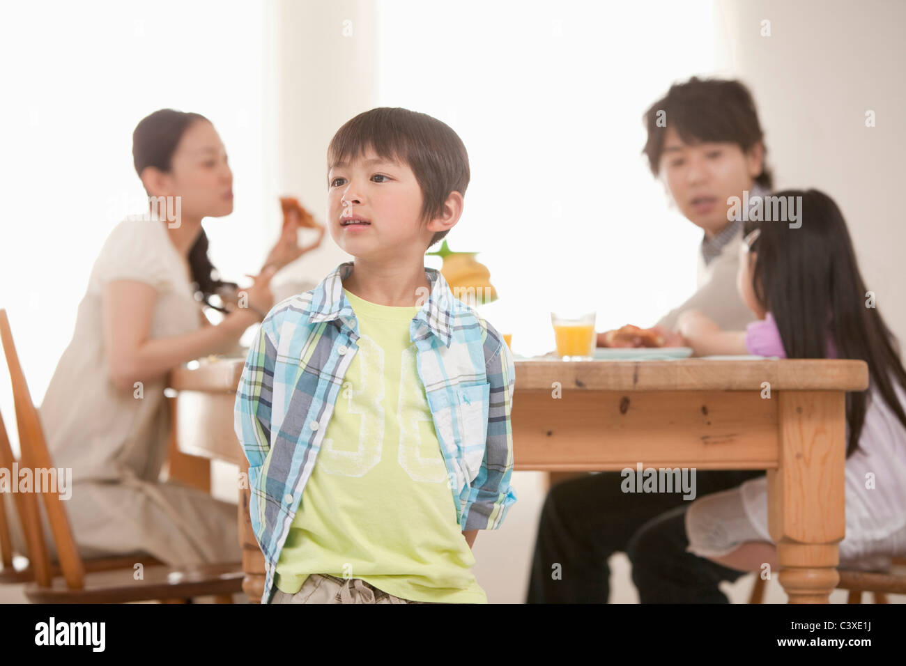 Boy Near Dining Table Stock Photo - Alamy