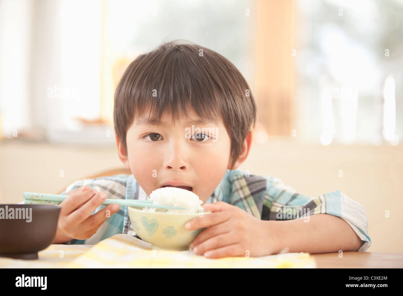 Boy Eating Rice Stock Photo - Alamy