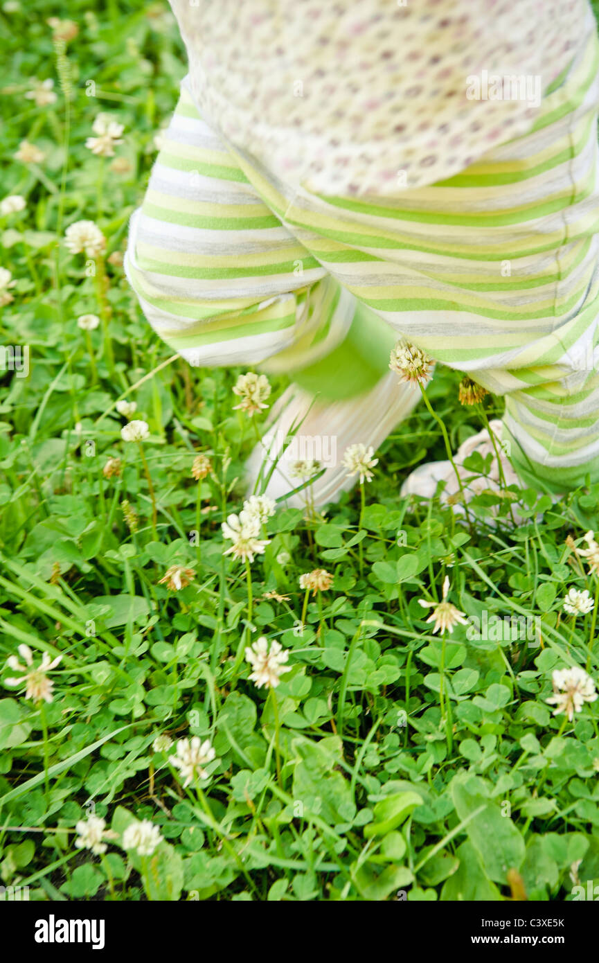 Baby girl taking her first steps Stock Photo - Alamy