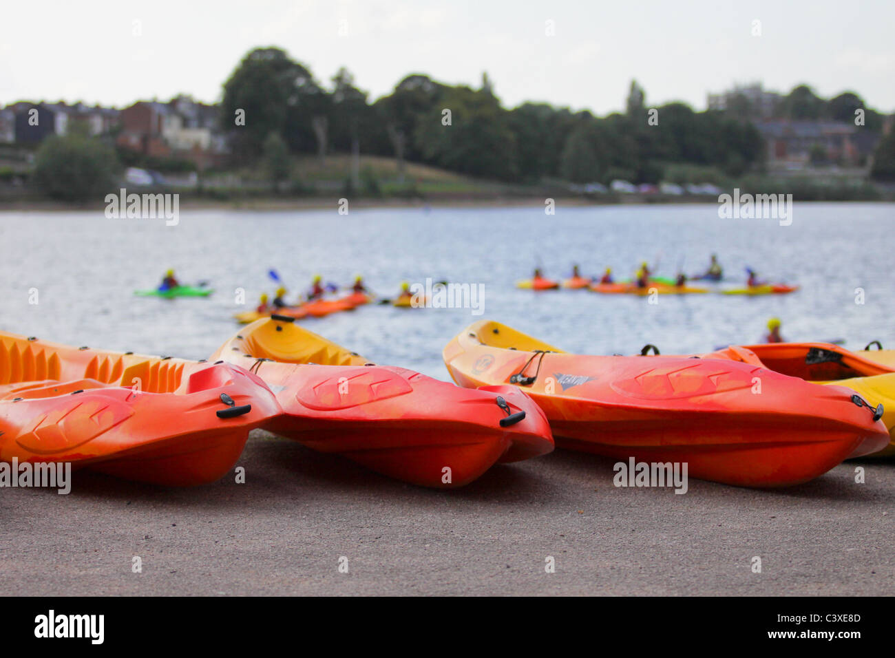 Brightly coloured kayaks ready for action Stock Photo - Alamy