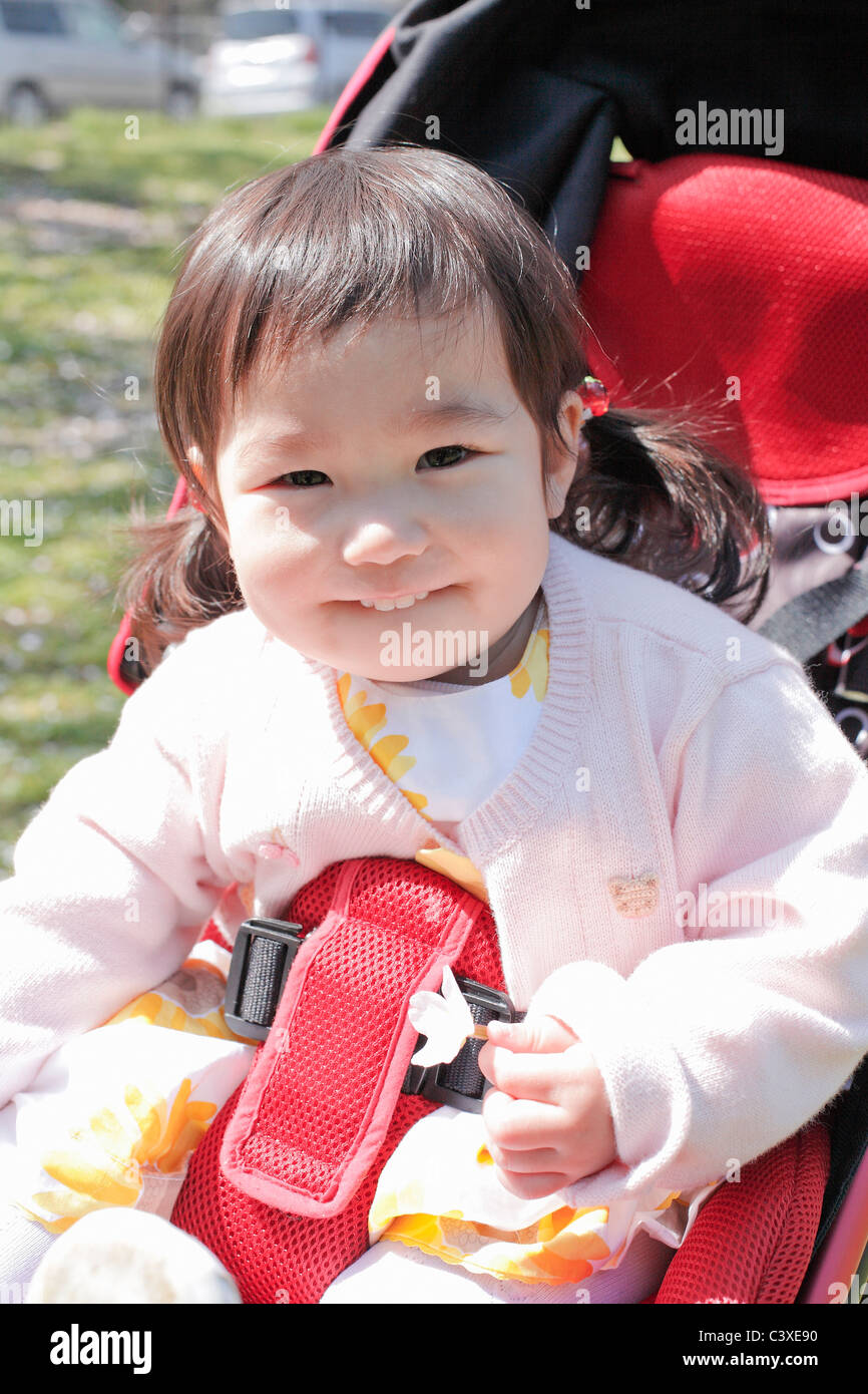 Baby Girl in Buggy Stock Photo - Alamy
