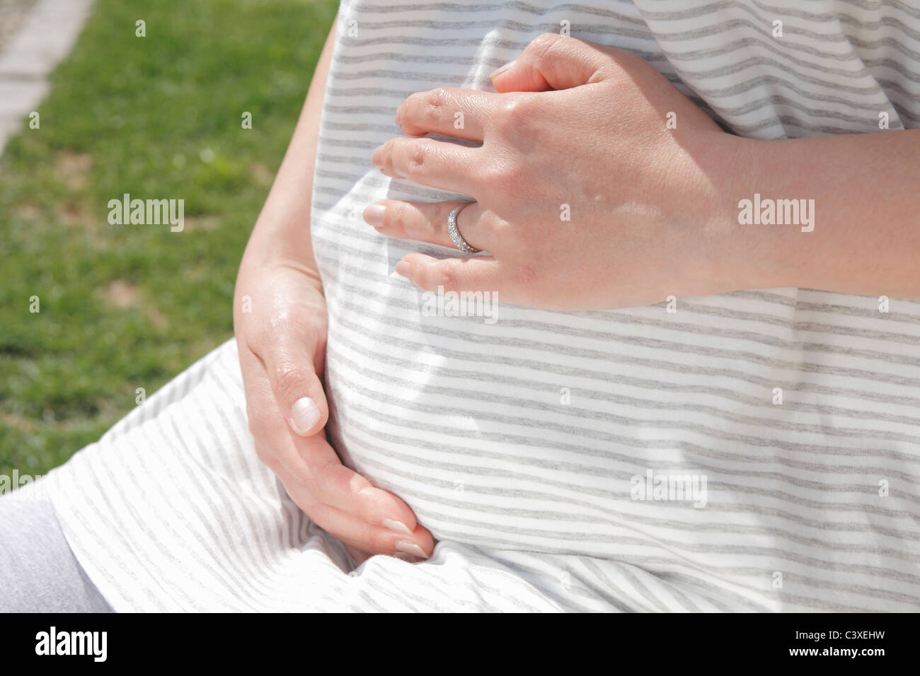 Hand Resting On Stomach High Resolution Stock Photography and Images ...