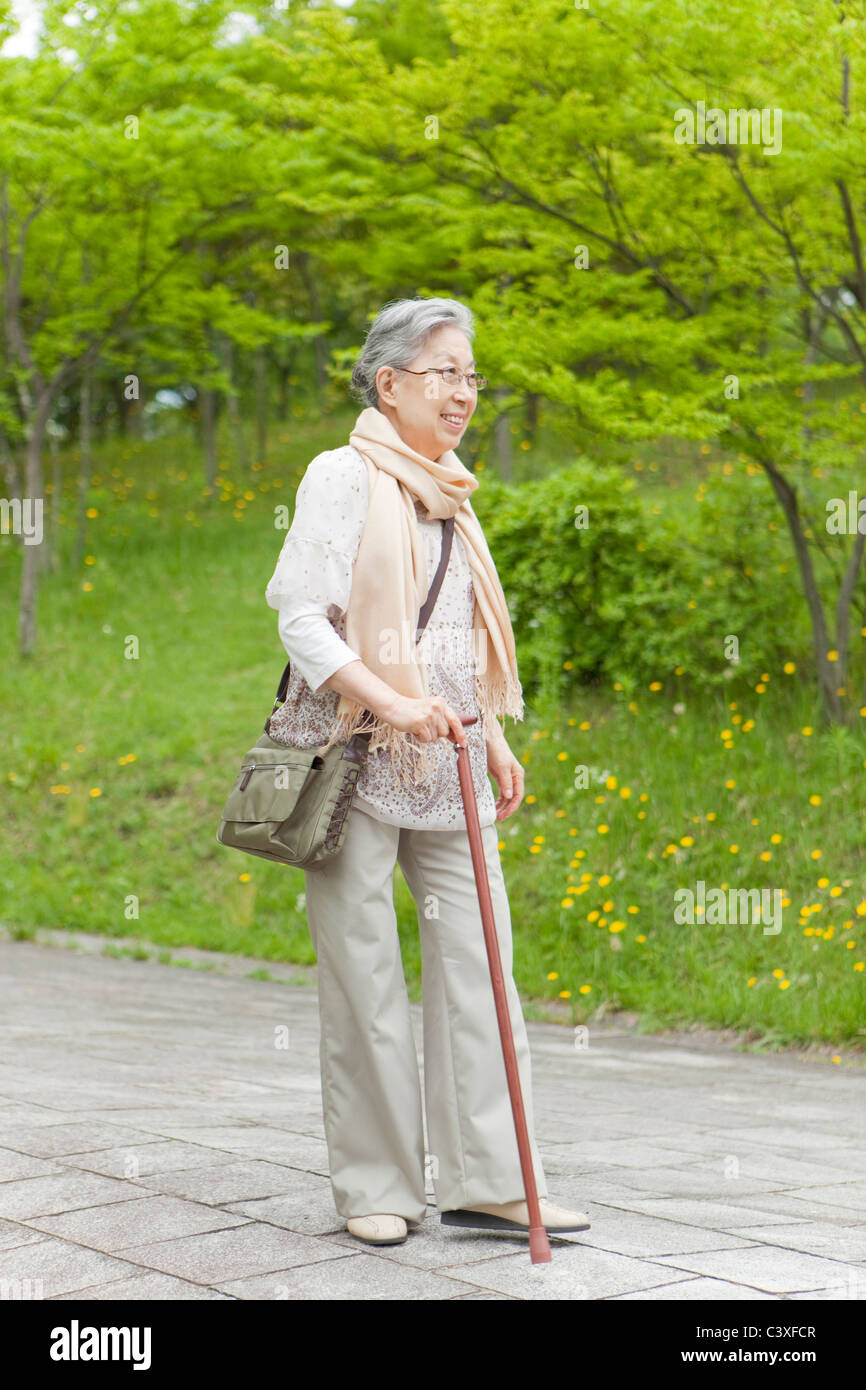 Senior Woman Walking Stock Photo - Alamy