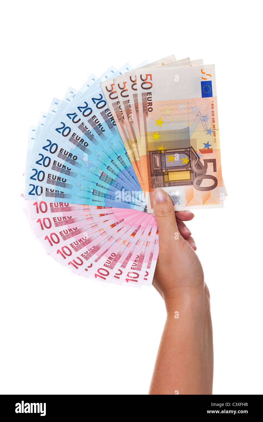 Photo of a womans hand holding a fan of Euro banknotes, isolated on a ...