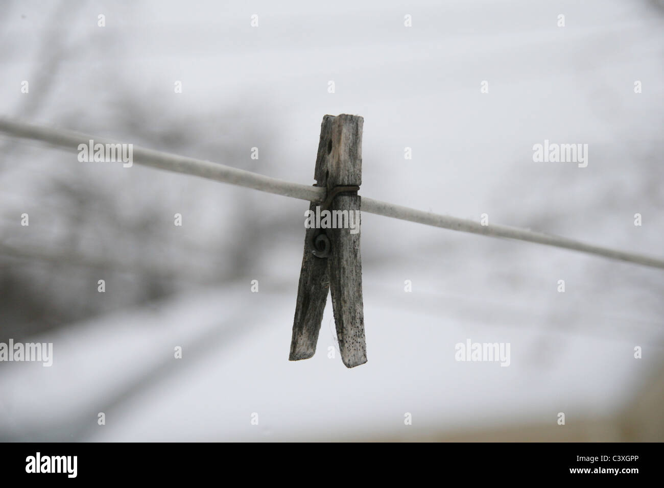 A single clothespin on a line Stock Photo - Alamy