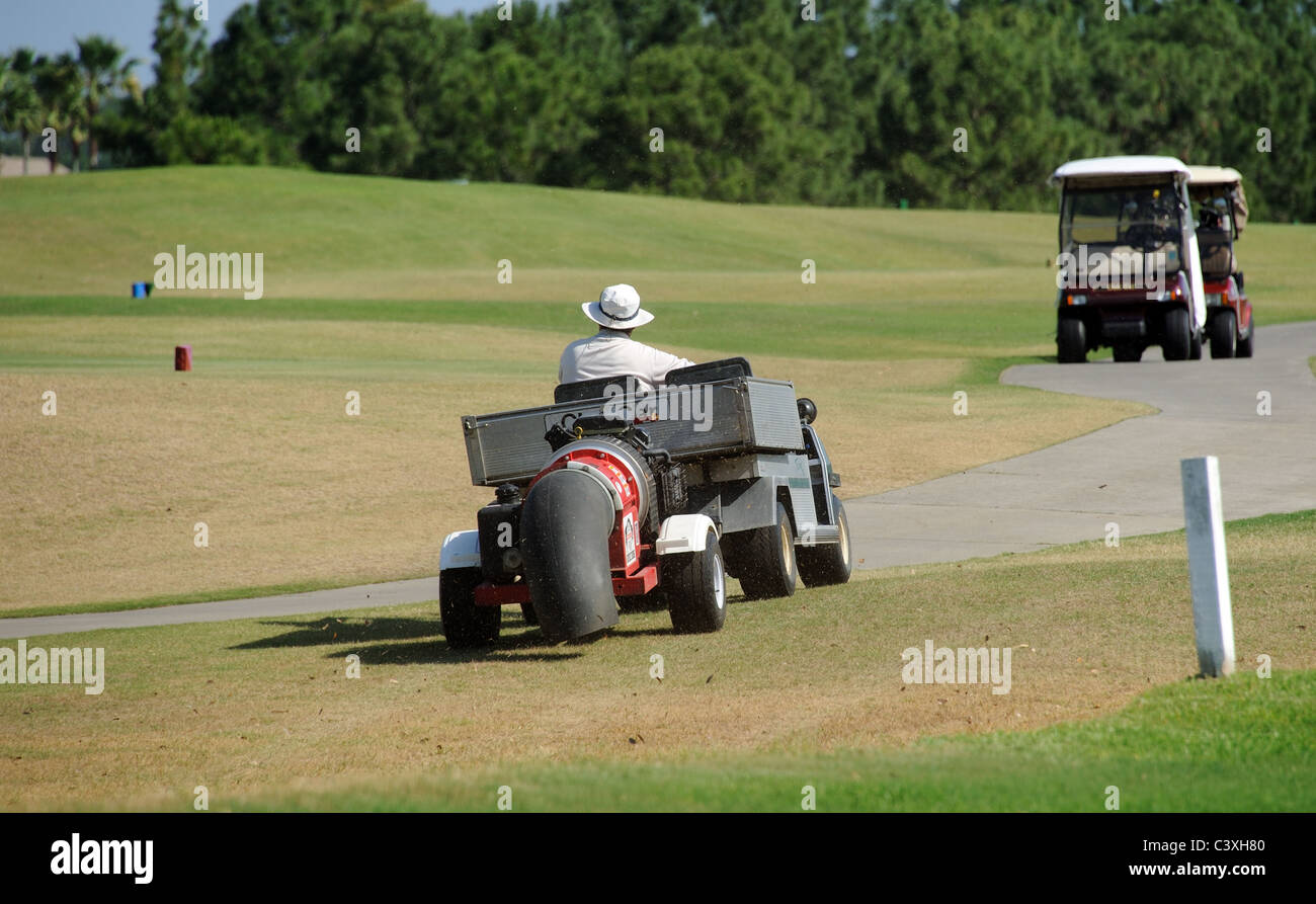 Golf course blower maintenance vehicle Stock Photo - Alamy