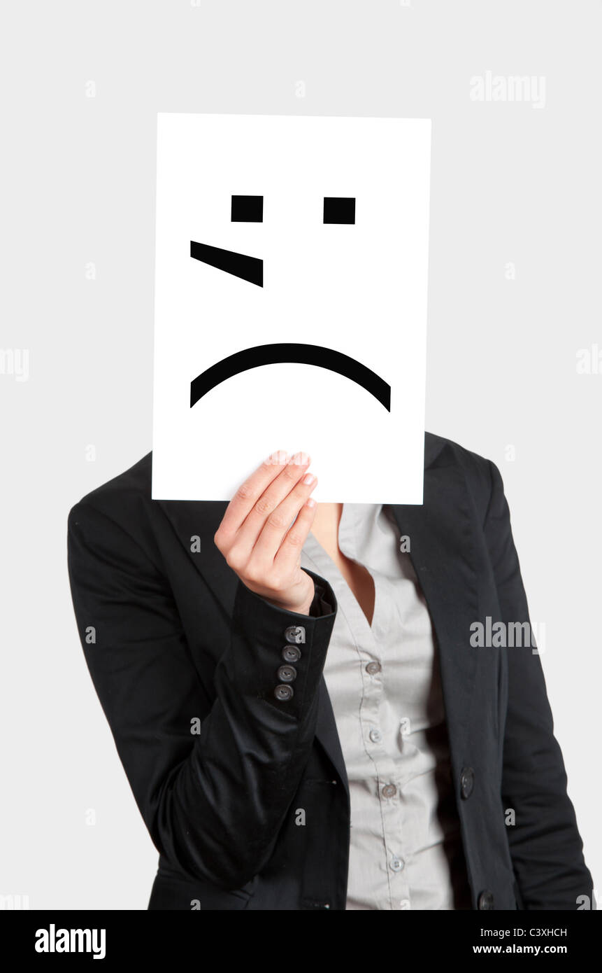 Woman showing a blank paper with a crying emotion in front of her face ...