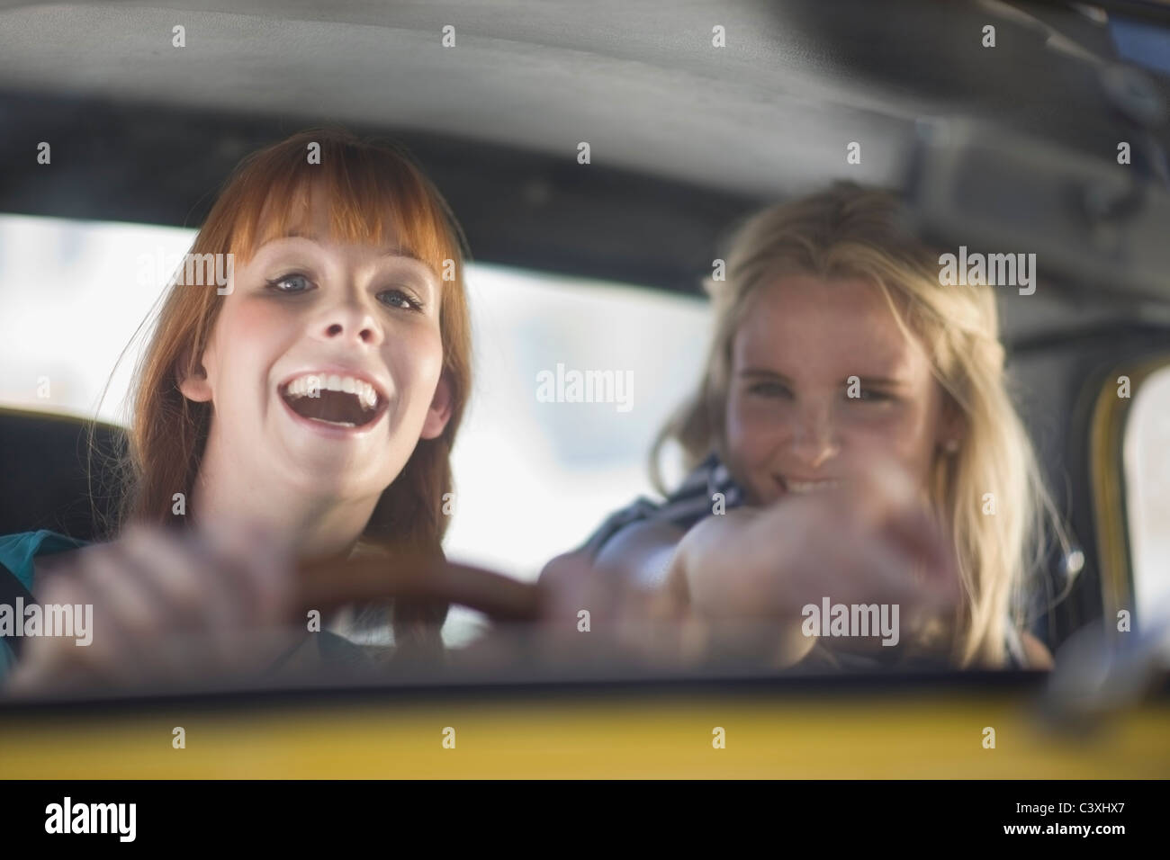 Women having fun driving a car Stock Photo - Alamy