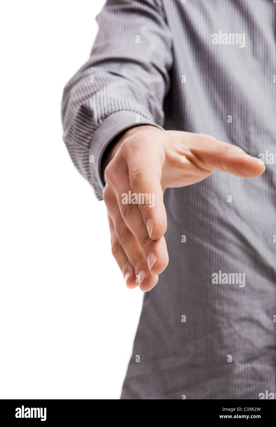 Casual young man giving a handshake, isolated on white Stock Photo - Alamy