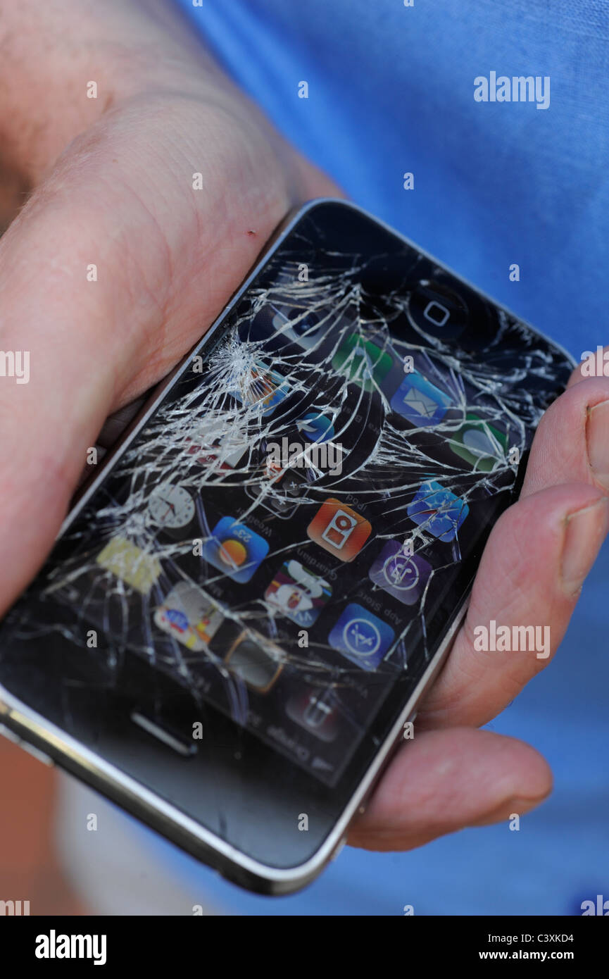 english man with a smashed iphone in the street Stock Photo - Alamy