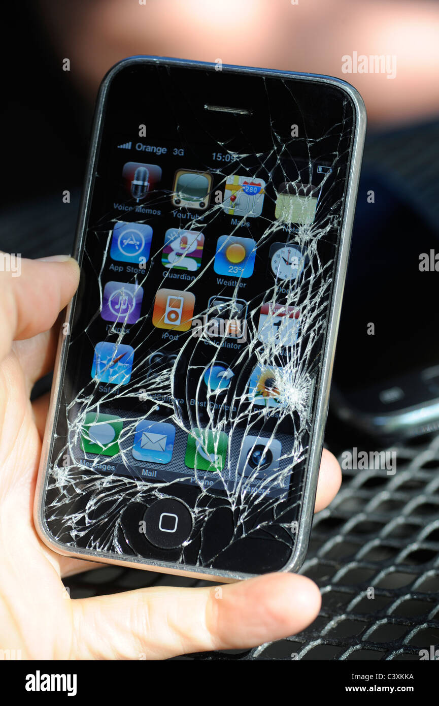 english man with a smashed iphone in the street Stock Photo - Alamy