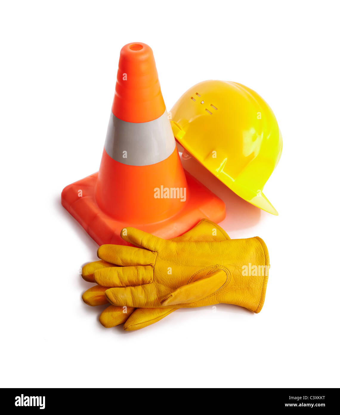 yellow hardhat,Traffic cone and working gloves isolated on white ...
