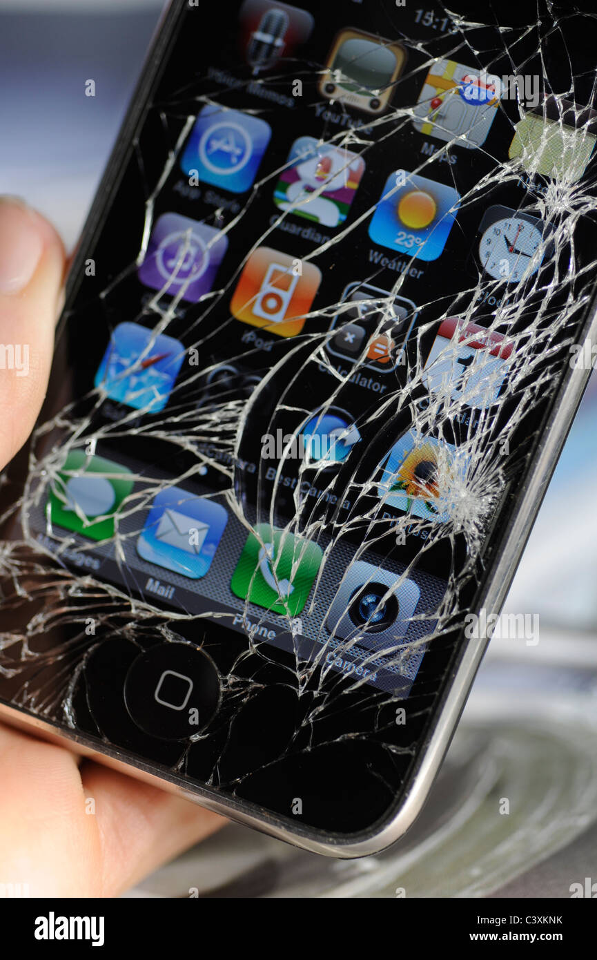 english man with a smashed iphone in the street Stock Photo - Alamy