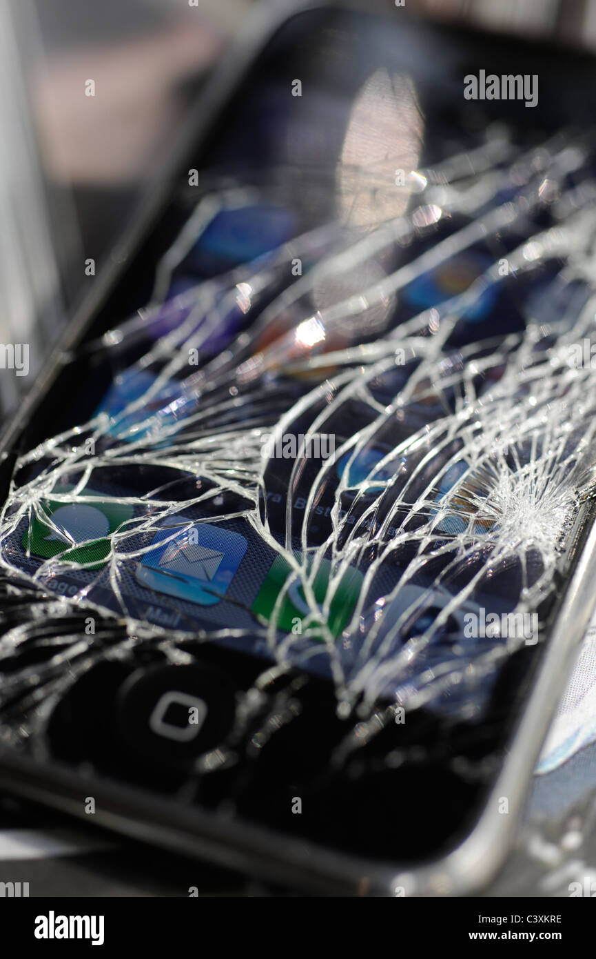 english man with a smashed iphone in the street Stock Photo - Alamy