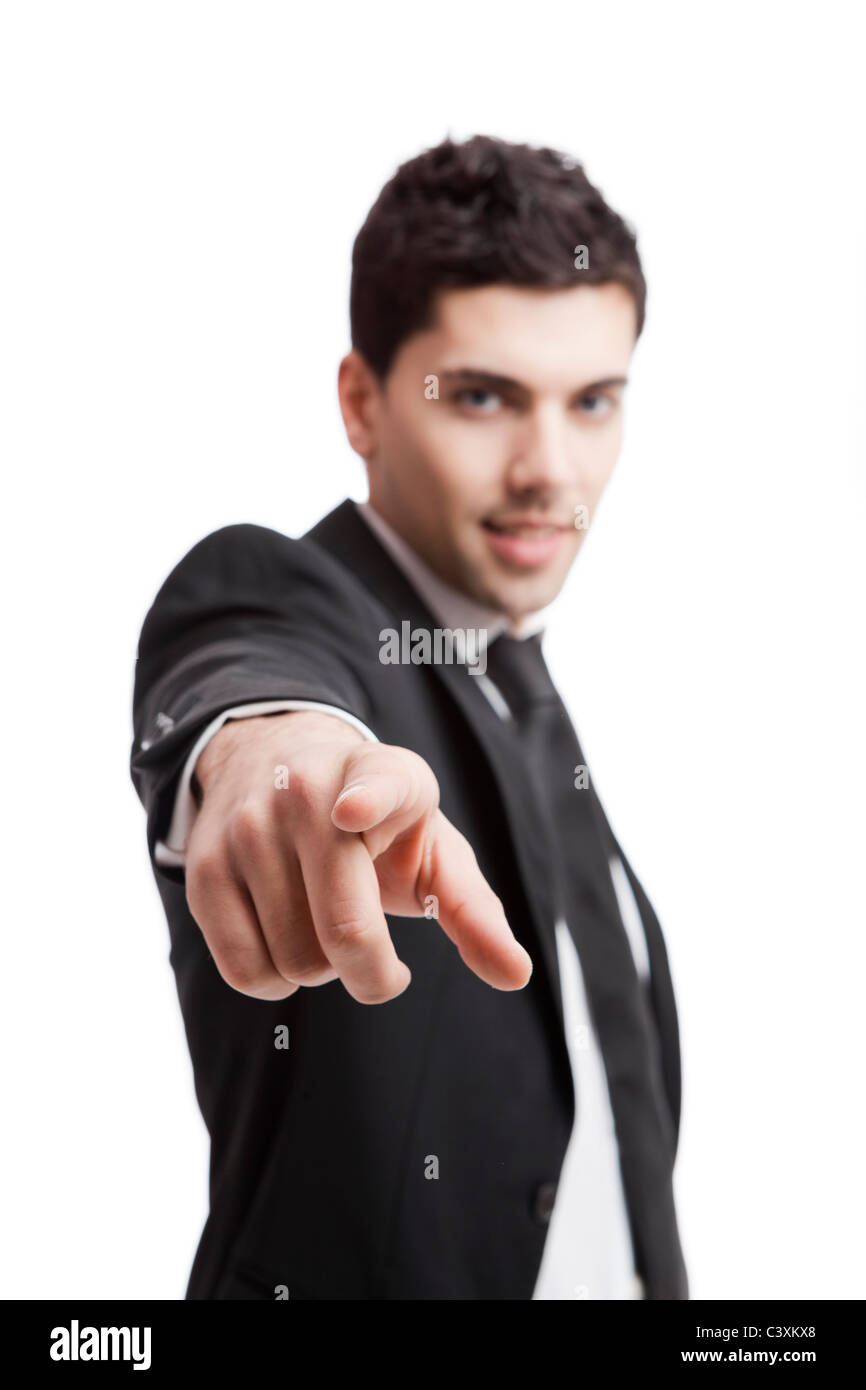 Young businessman pointing to you, isolated over a white background ...