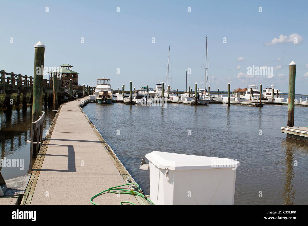 Marina and boardwalk on saltwater marsh. chriskirkphotography.net Stock ...