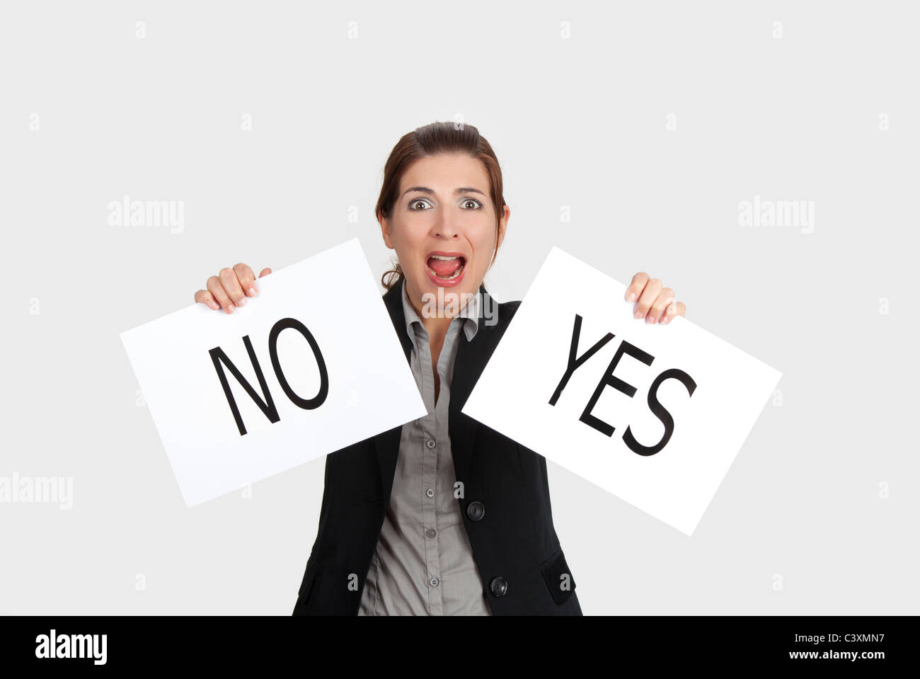 Business young woman trying to make a decision between Yes or No choice ...