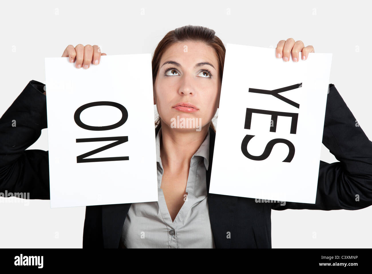 Business young woman trying to make a decision between Yes or No choice ...