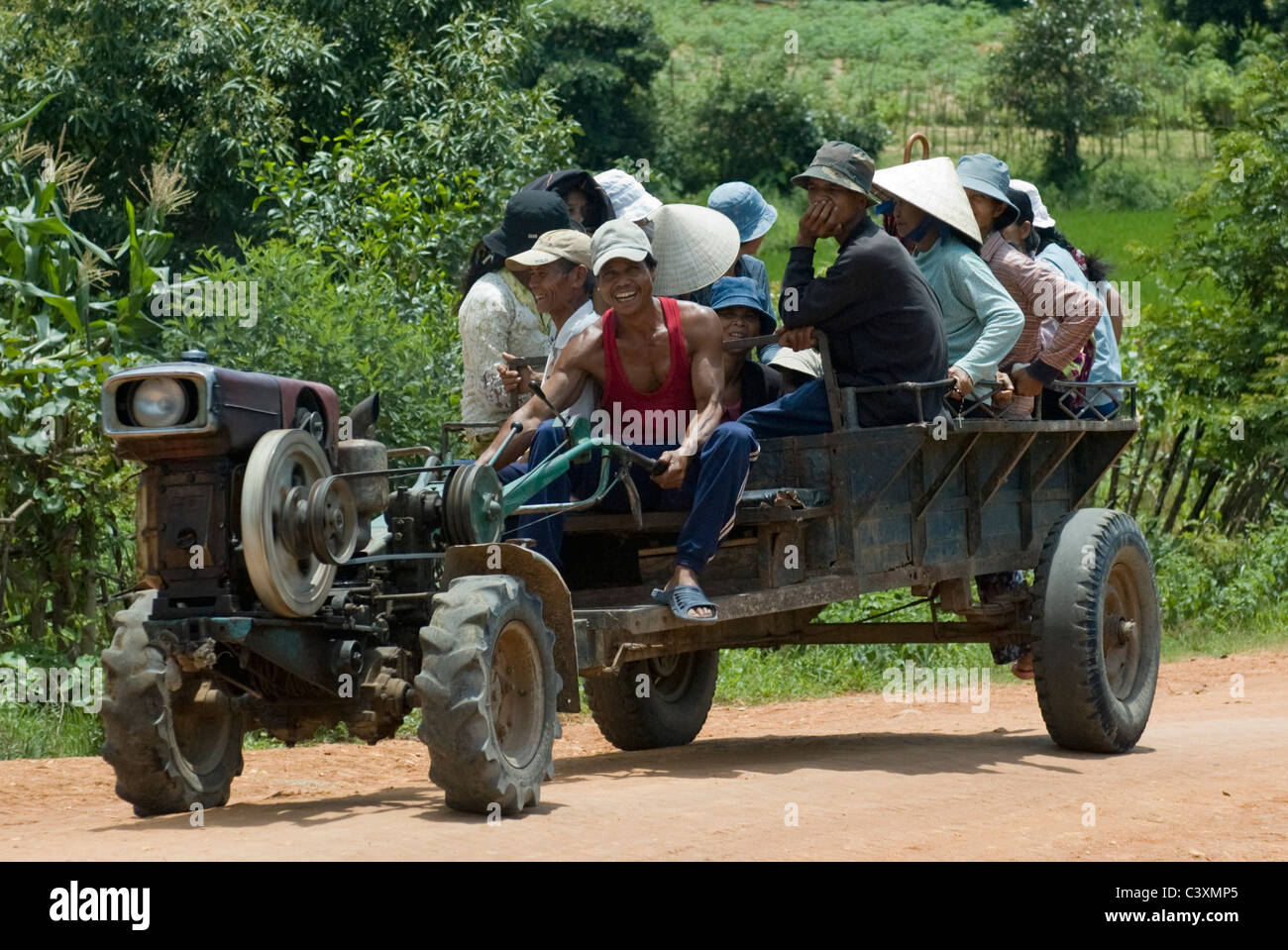 A tractor is used to transport villagers Stock Photo - Alamy