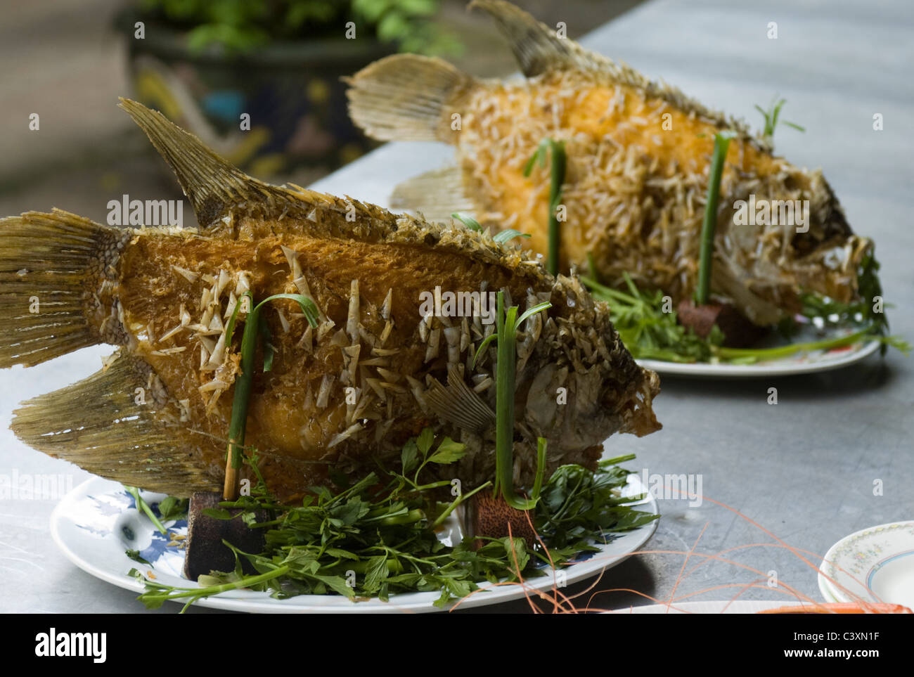 Fried fish served at a restaurant Stock Photo - Alamy