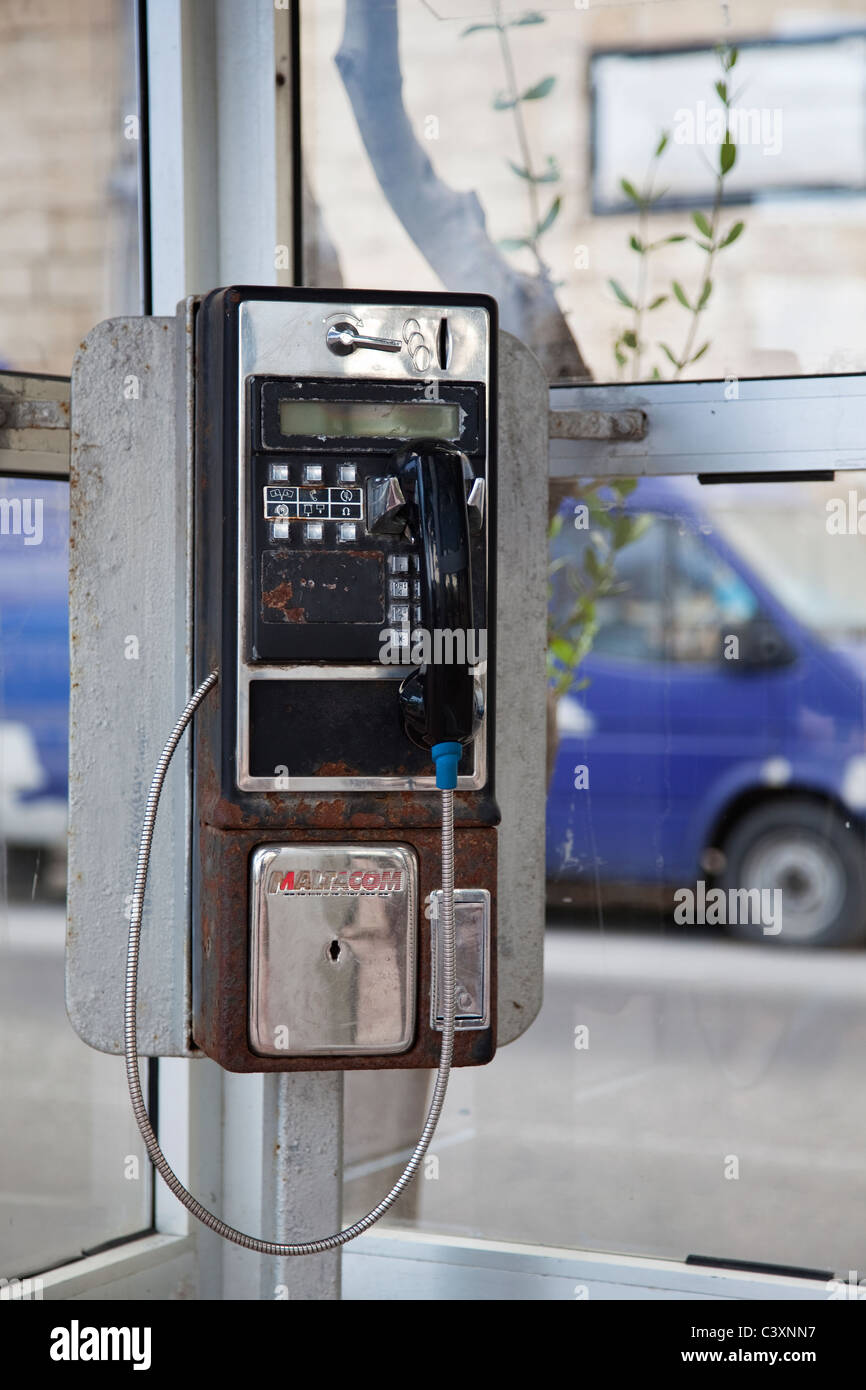 Old coin-operated telephone set in the street Stock Photo - Alamy