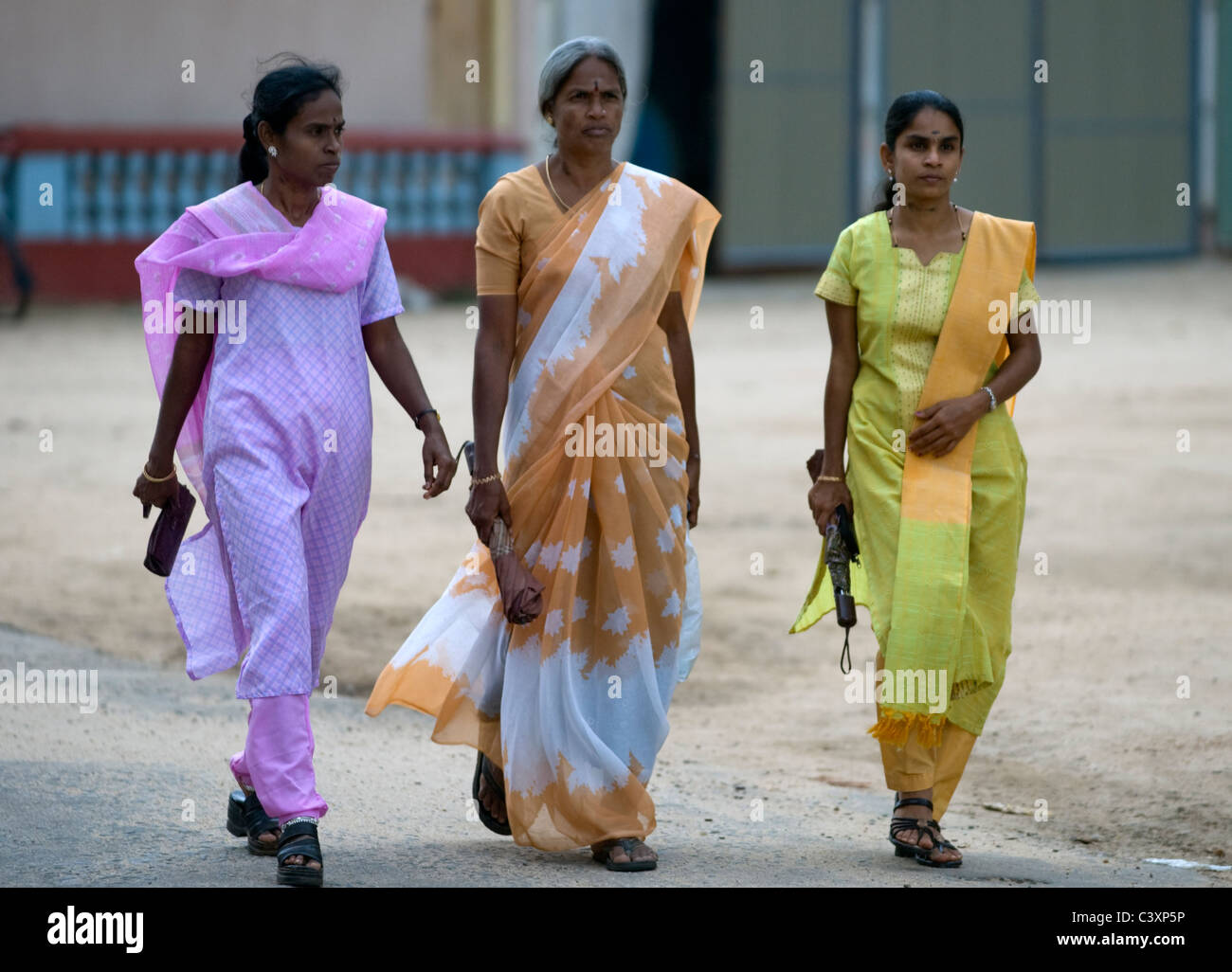 Hindu women walk in the street Stock Photo - Alamy