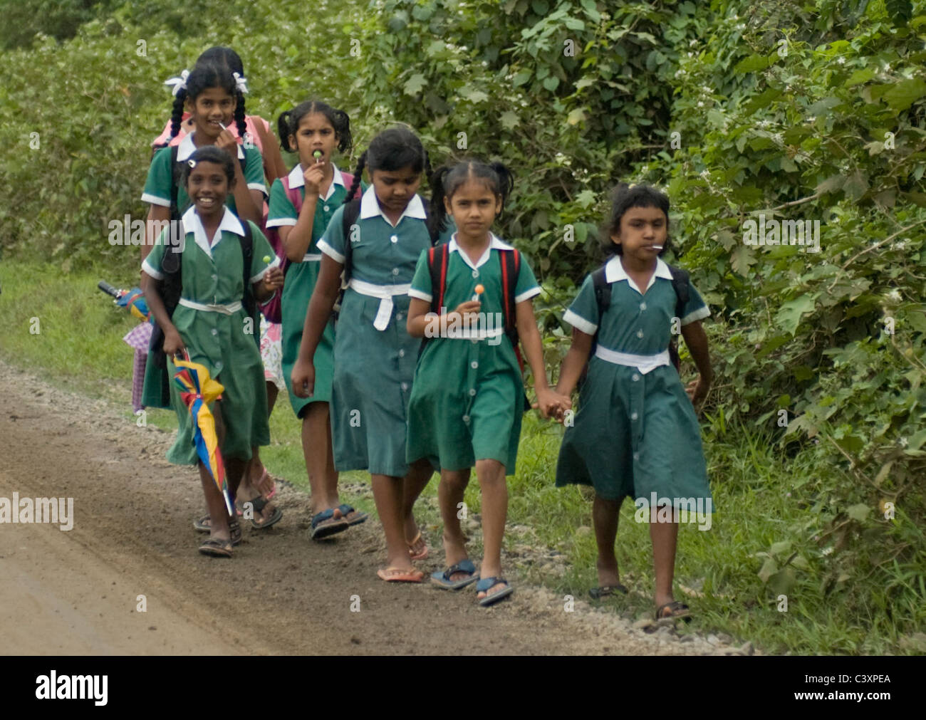 Children walk to school in uniform Stock Photo - Alamy