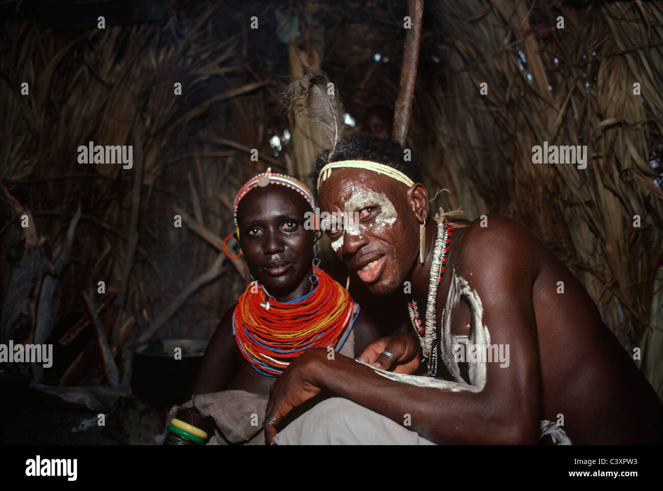 El Molo Warrior painted and adorned, with his wife, for a tribal ...