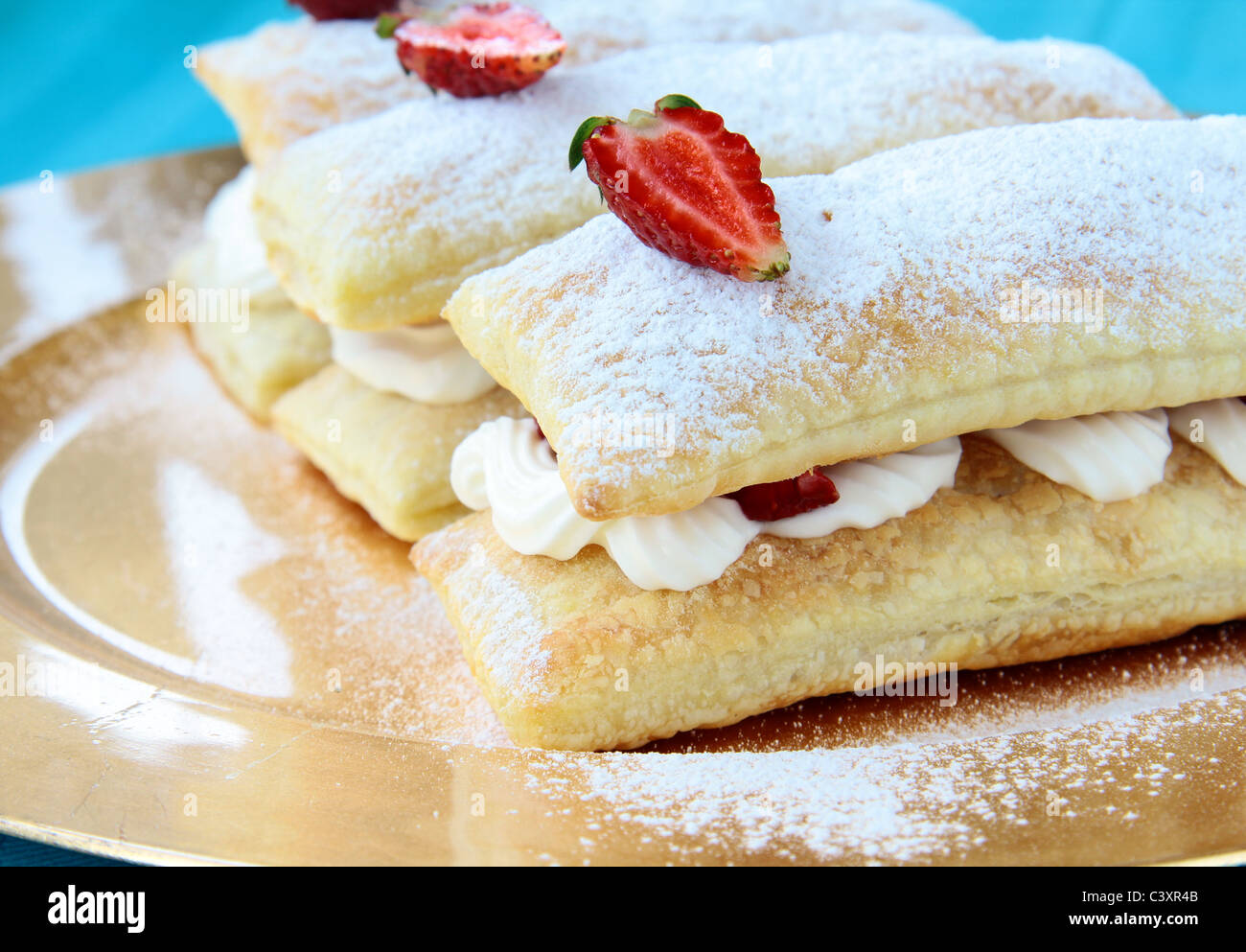 dessert cake of puff pastry, whipped cream and strawberries Stock Photo ...