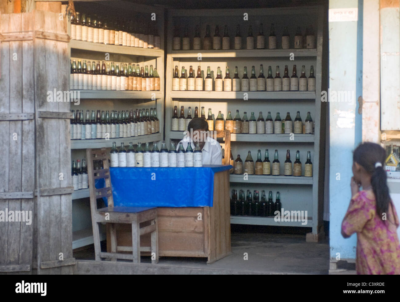 A salesman sits in his shop Stock Photo - Alamy