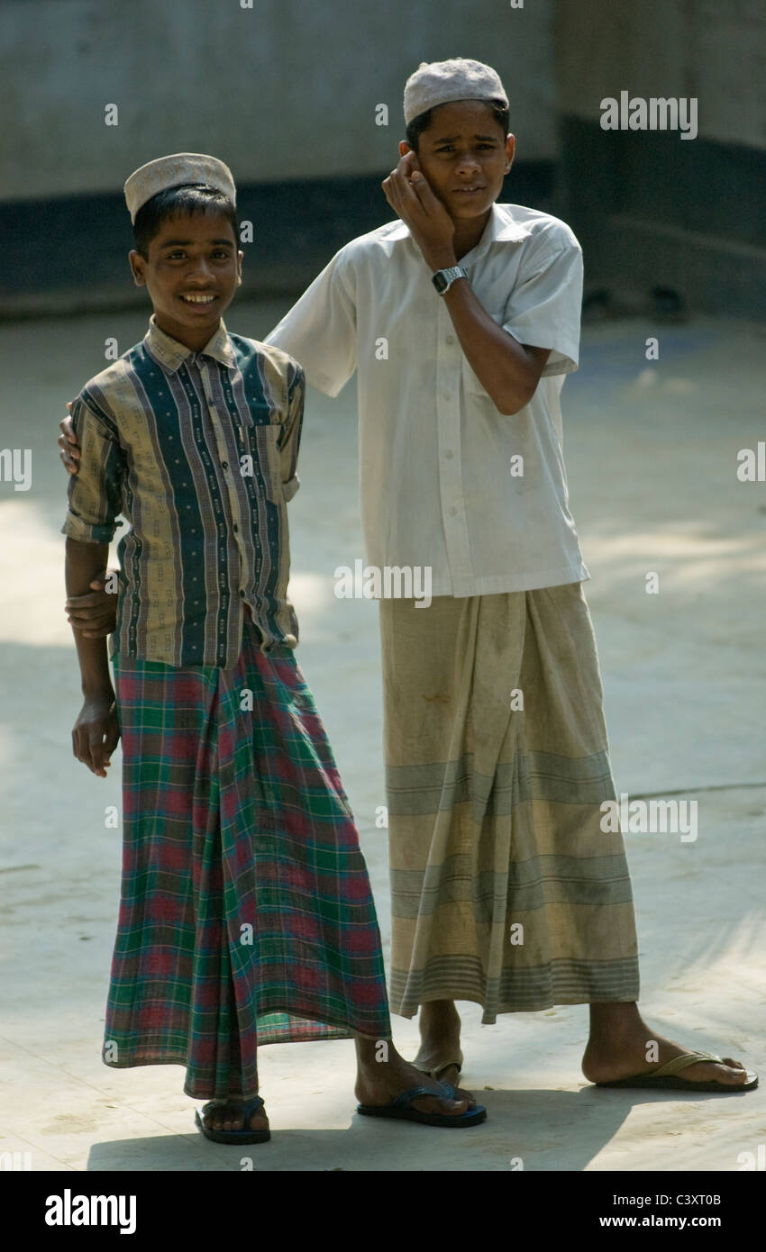 Two muslim boys stand near a mosque Stock Photo - Alamy