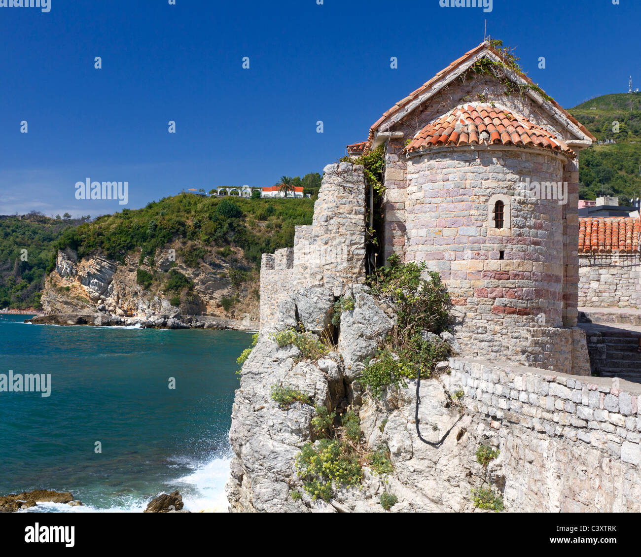 historic watch tower built of rough stone on a old city wall ...