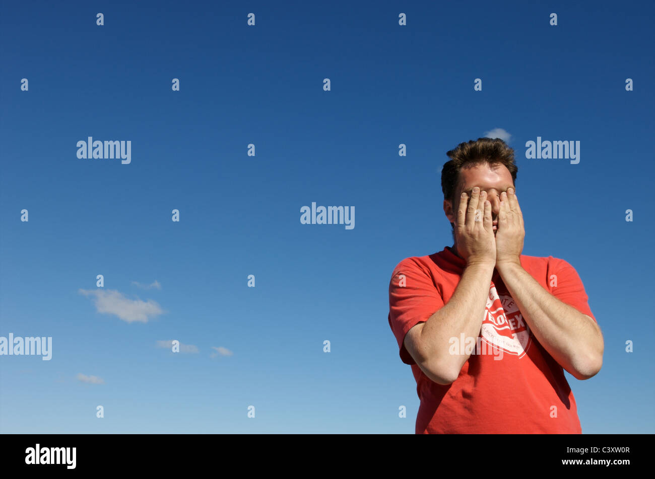 A man holding his head Stock Photo - Alamy