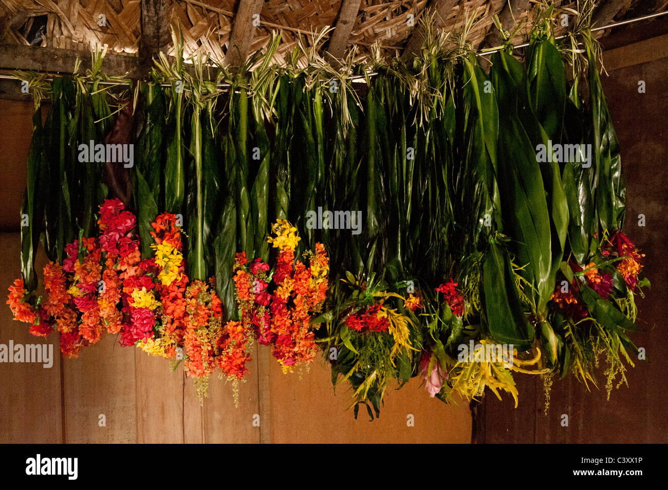 flower lei's hanging awaiting to be used to greet arriving tourists ...