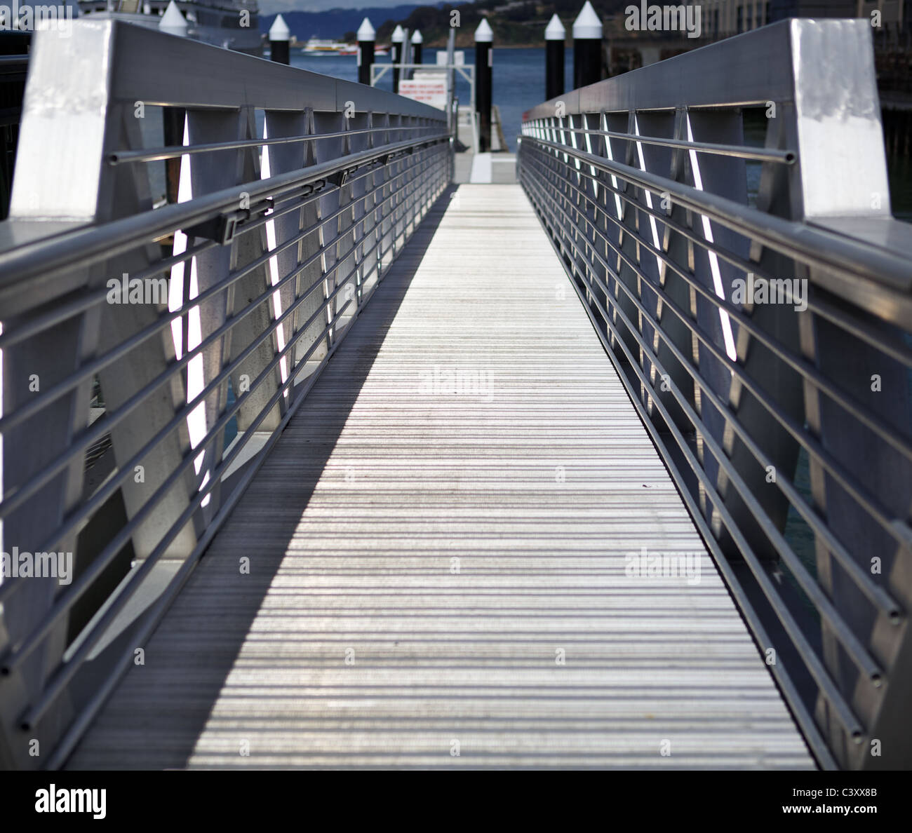 Diminishing perspective image of a long aluminum ramp Stock Photo - Alamy
