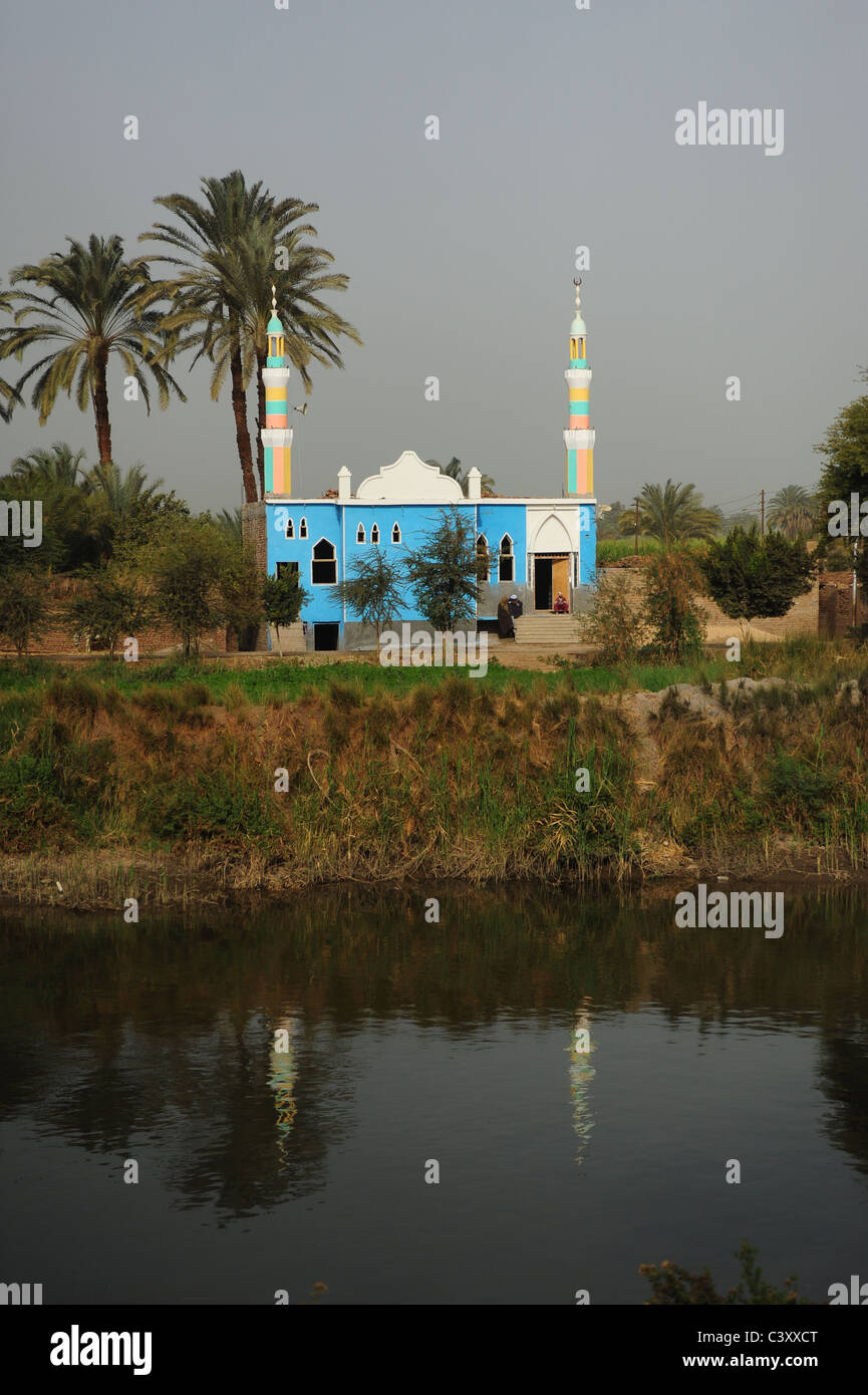 Africa Middle East Egypt Egyptian a lone mosque stands along a canal in ...