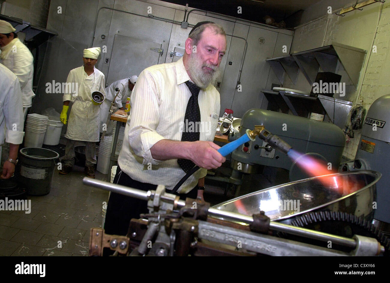 Rabbi from the OK Koshering group supervises the kashering of baking ...