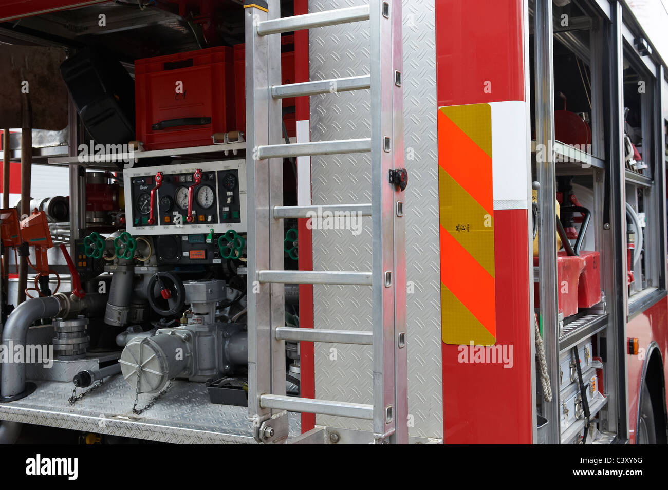 Fire engines, water hoses, nozzles and other equipment at a fire ...