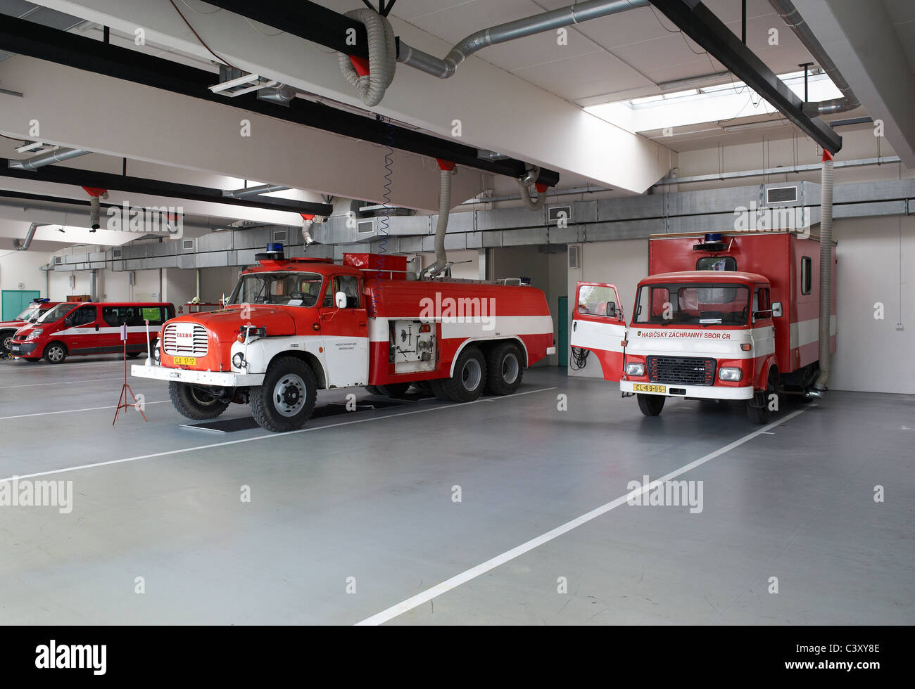 Fire engines, water hoses, nozzles and other equipment at a fire ...