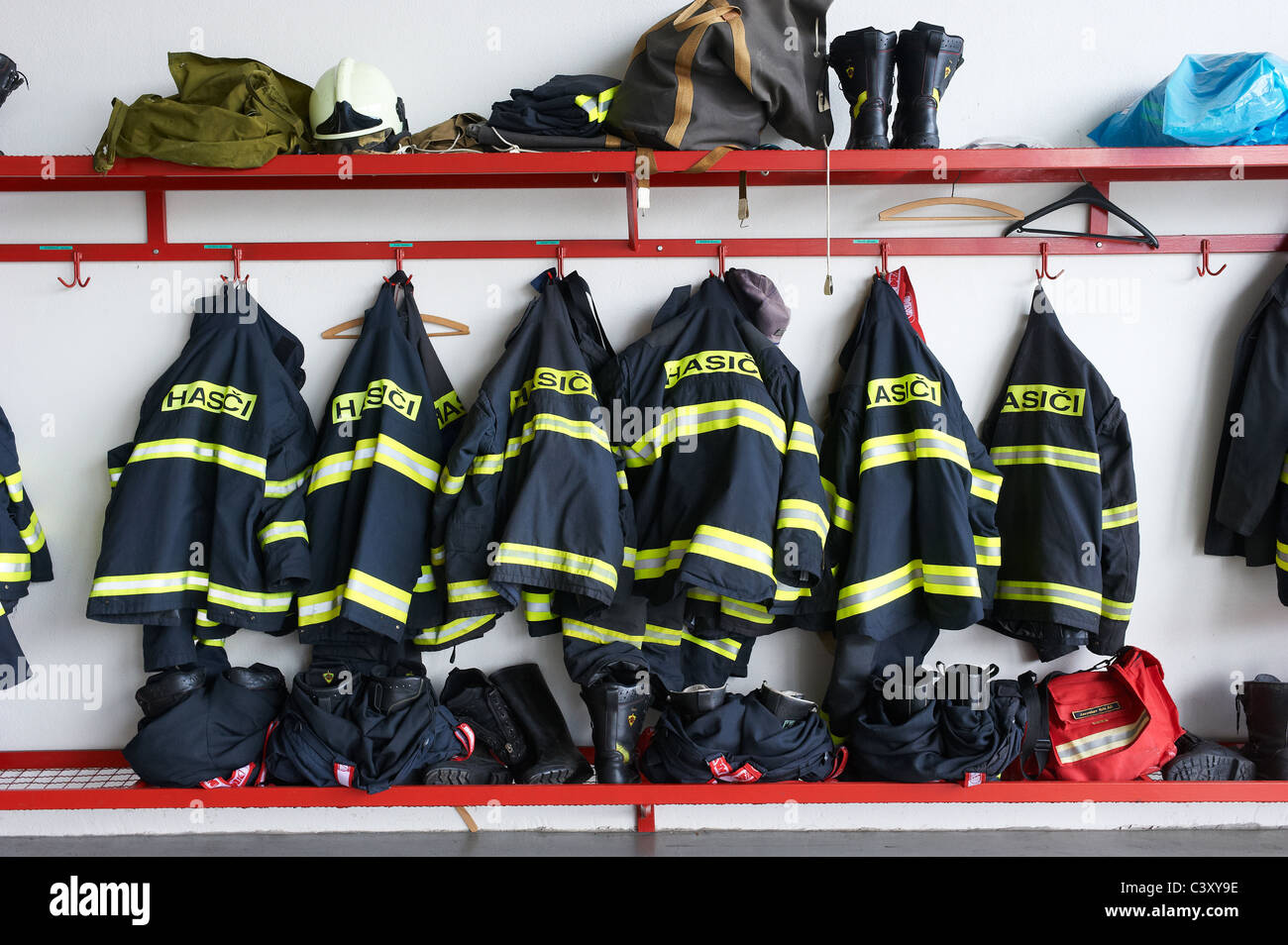 Fire engines, water hoses, nozzles and other equipment at a fire ...