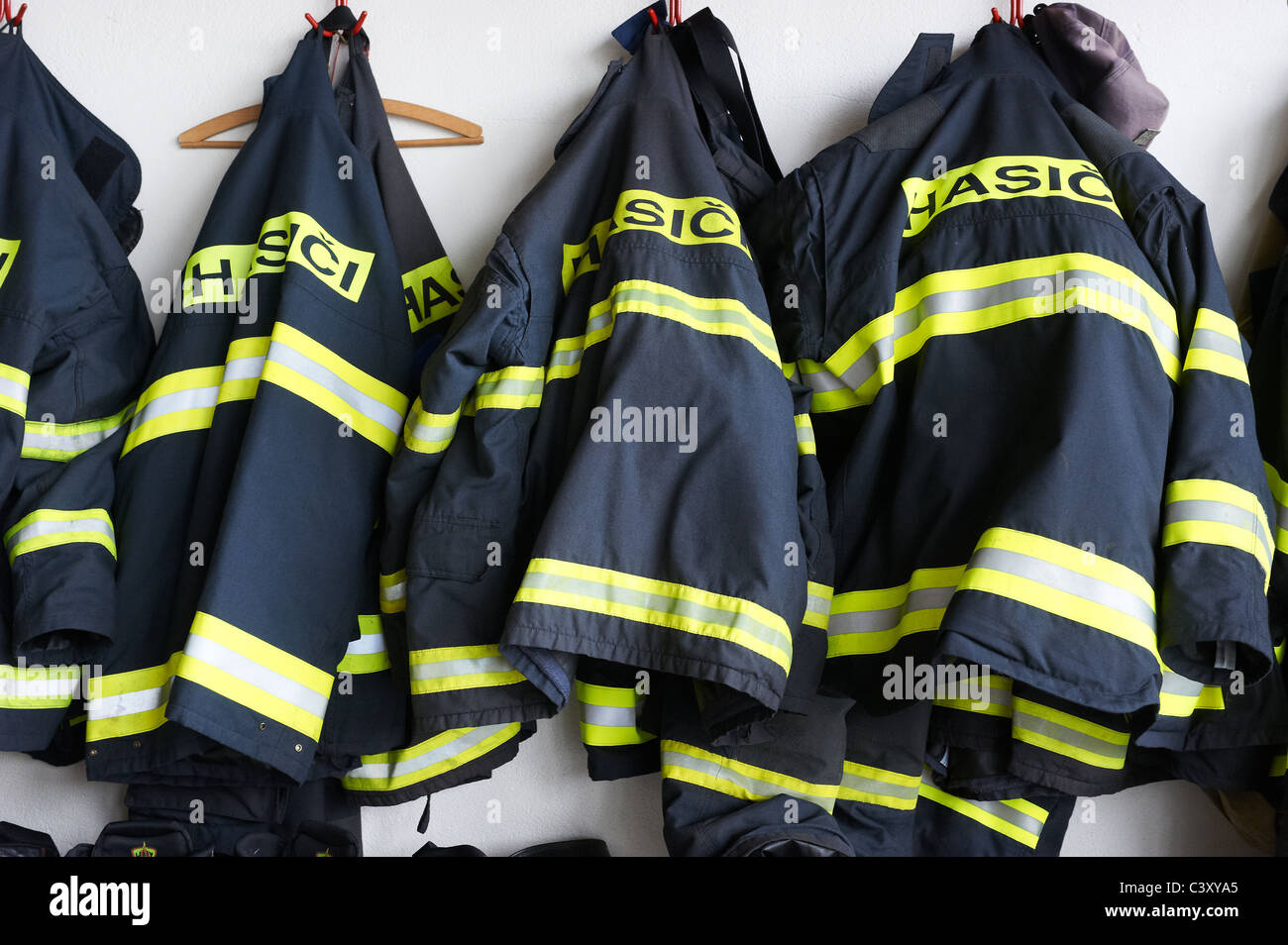Fire engines, water hoses, nozzles and other equipment at a fire ...