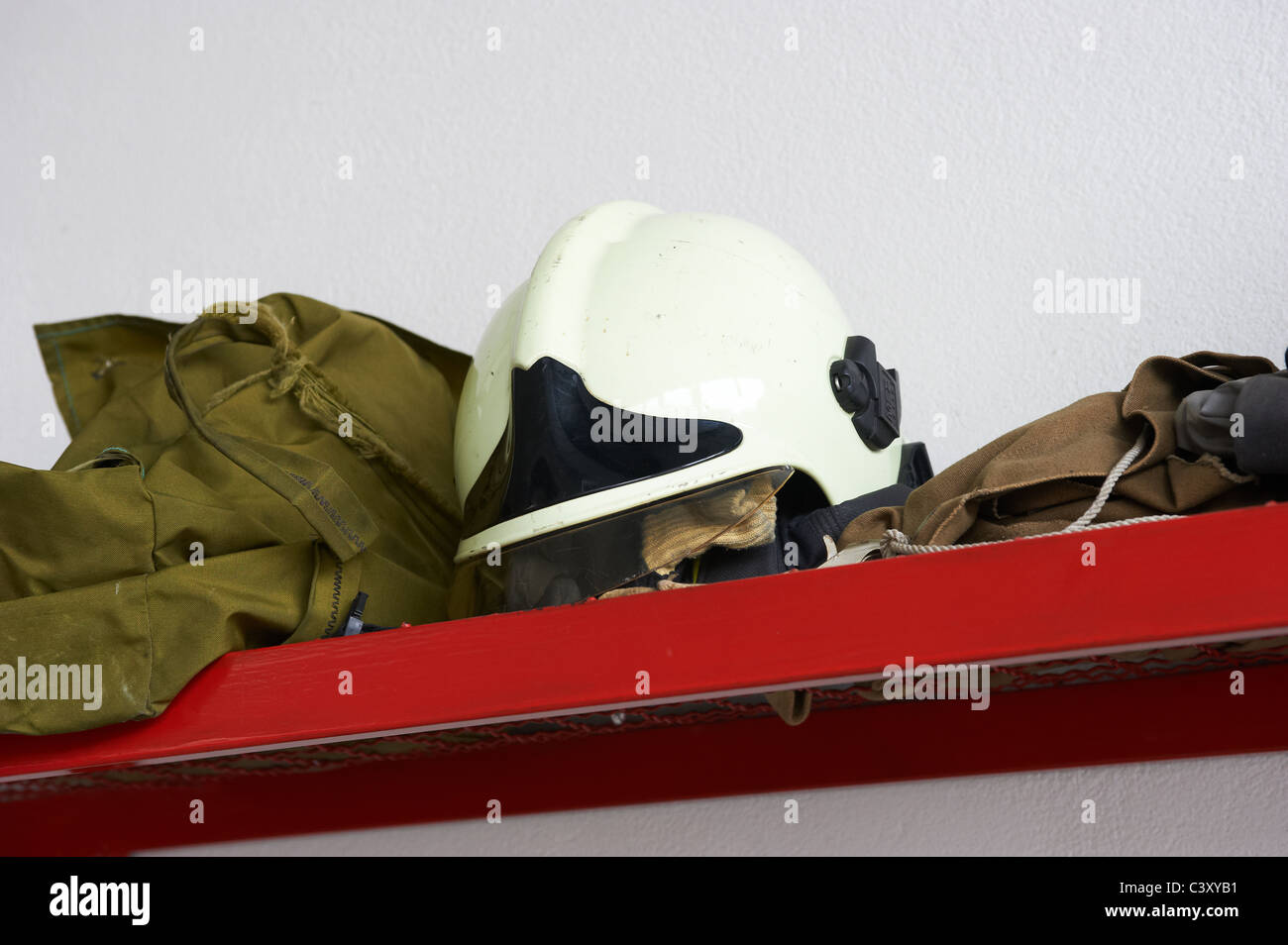 Fire engines, water hoses, nozzles and other equipment at a fire ...