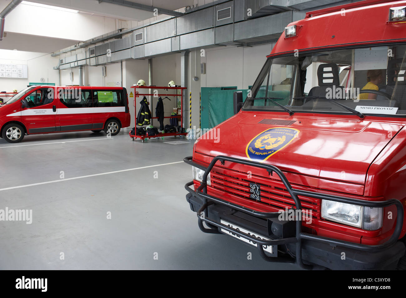 Fire engines, water hoses, nozzles and other equipment at a fire ...